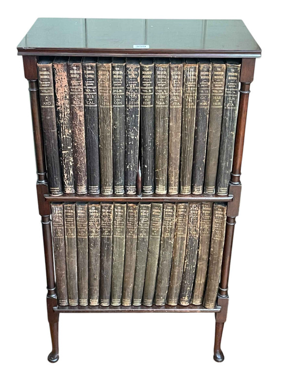 Edwardian mahogany two tier open bookcase on pad feet with a complete ...