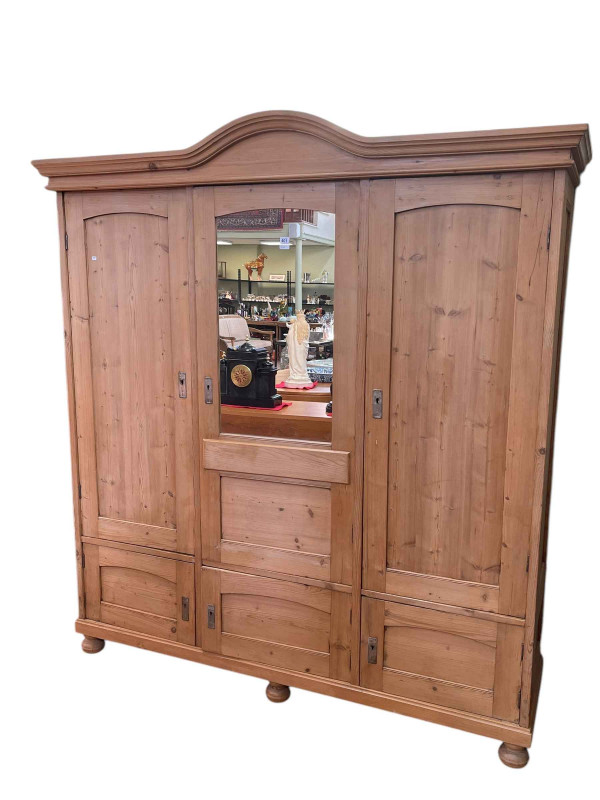 Continental pine arched top wardrobe having three doors, one with ...