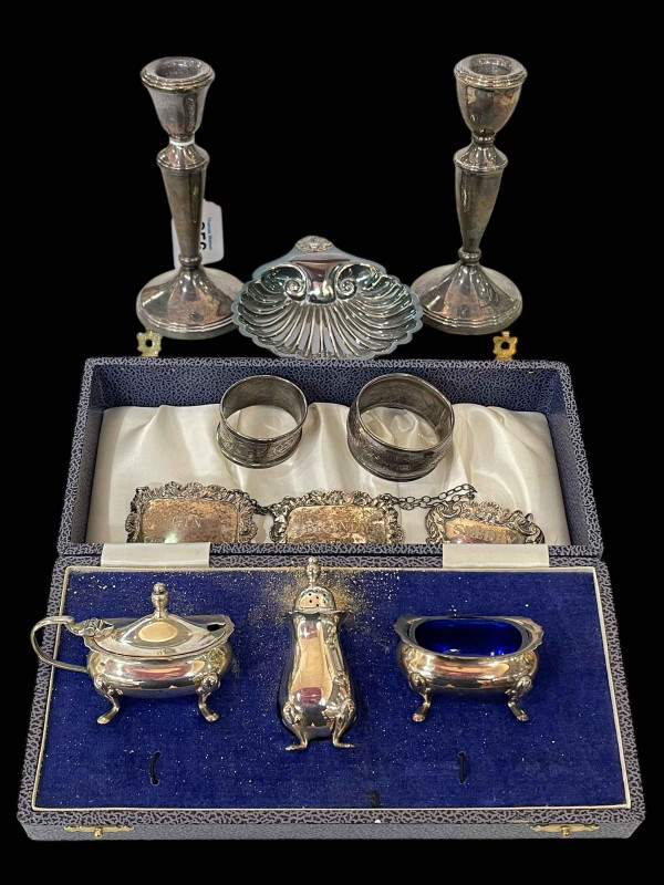 Silver items comprising shell butter dish, cruet set, pair candlesticks ...