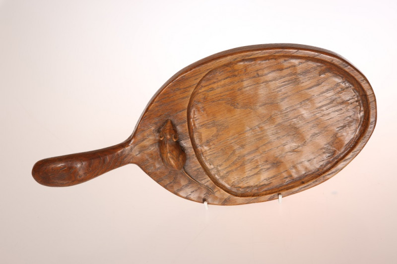 ROBERT THOMPSON OF KILBURN, A RARE MOUSEMAN CHEESEBOARD, of dished oval ...